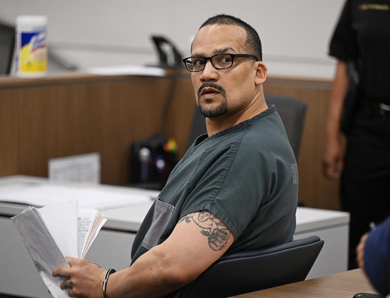 Man sentenced to life for killing Melvindale cop, kicked out of court ...
